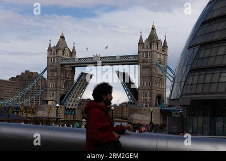 London's iconic Tower Bridge in its raised position Stock Photo - Alamy