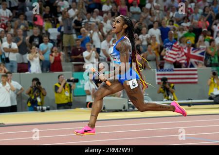Sha'Carri Richardson, from the United States, crosses the finish line ...