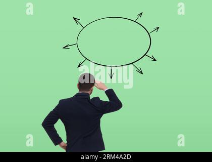Logic. Man standing in front of diagram on white background, back view ...