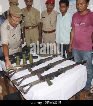 A United Liberation Front of Assam (ULFA) militant surrenders his arms ...