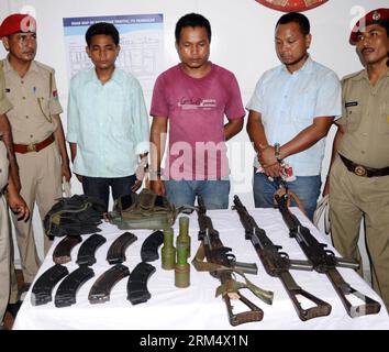 A United Liberation Front of Assam (ULFA) militant surrenders his arms ...