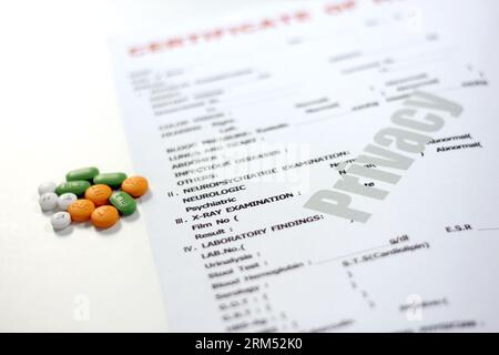 Health checkup exam paper chart and pills, medical privacy concept ...
