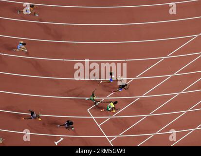Sha'Carri Richardson, from the United States, crosses the finish line ...