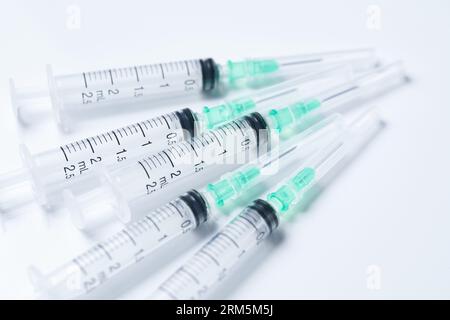 Multiple syringes placed on a white background Stock Photo - Alamy