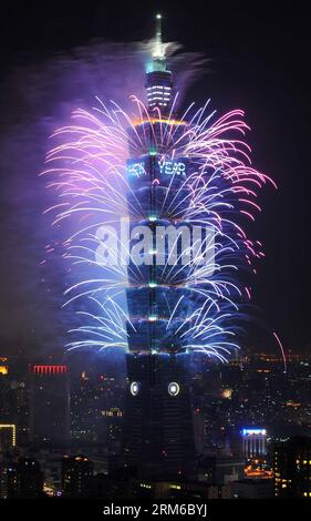 Fireworks explode from the Taipei 101 building during the New Year's ...