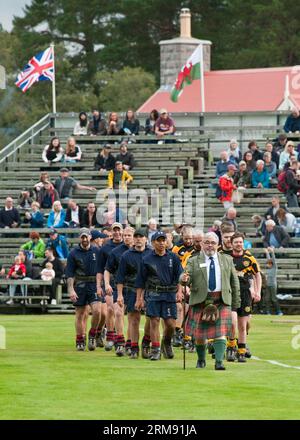 Tug of War teams entering the field, Braemar Highland Games, Scotland ...