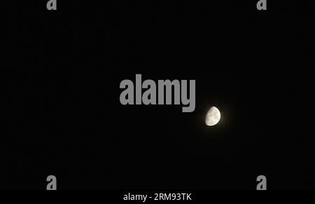 half moon cover by spreading cloud in night Stock Photo - Alamy