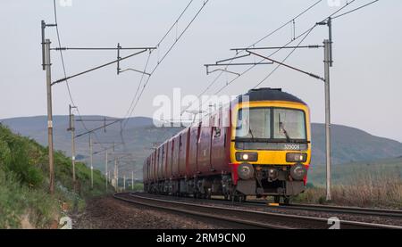 2 Royal mail class 325 trains climbing Shap bank Cumbria on the west ...