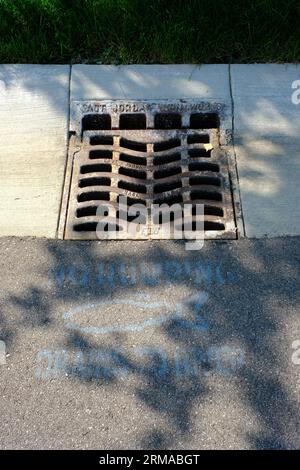 Cast iron storm drain grate Stock Photo - Alamy