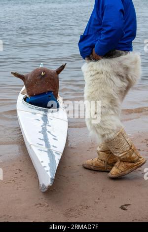 Northwestern Greenland. Man in traditional kayak Stock Photo - Alamy