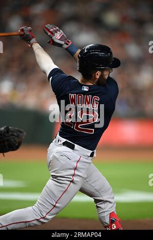 Boston Red Sox catcher Connor Wong, right, hangs onto the ball after ...