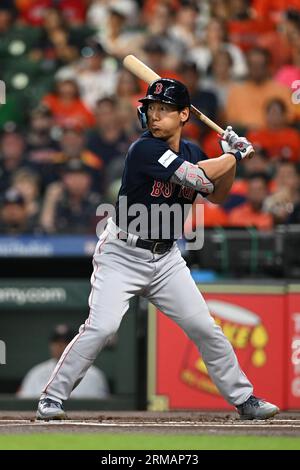 Masataka Yoshida of the Boston Red Sox hits a single in the second inning of a baseball game ...