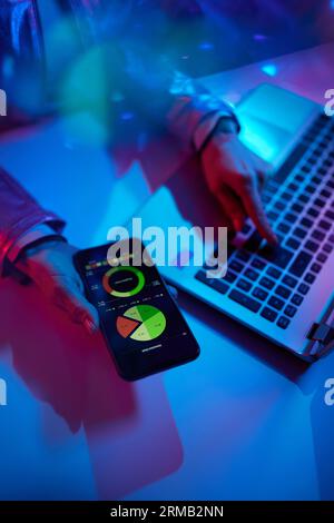 Businesswoman using virtual screen with graphs on dark background Stock ...