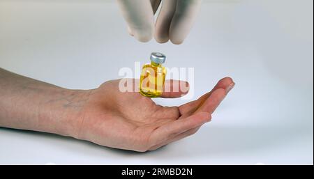Medical Product Falling into Hand against White Background Stock Photo ...