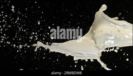 Exploding Milk against Black Background Stock Photo - Alamy