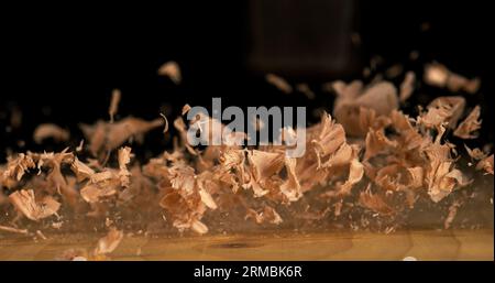 Wood Chips Falling on a Board Stock Photo - Alamy