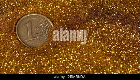 Coin of 1 Euro Rolling on Gold Powder against Black Background Stock ...