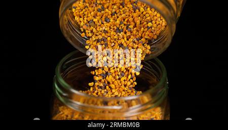 Pollen Dumplings Falling on Black Background, mortar and pestle Stock ...
