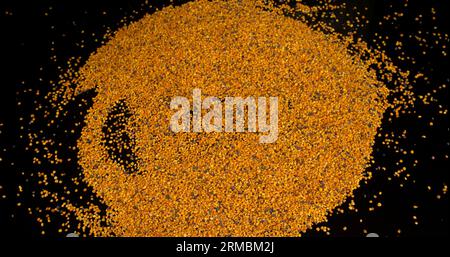 Pollen Dumplings Falling on Black Background Stock Photo - Alamy