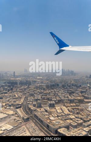 Dubai UAE from airplane with FlyDubai wing - view out of airplane ...