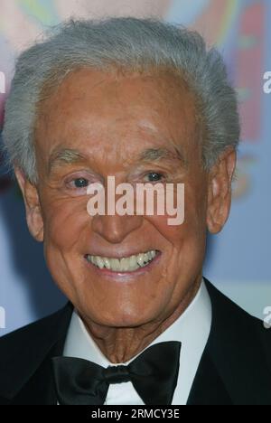 Bob Barker, host of ?The Price Is Right,? looks on as contestants play ...