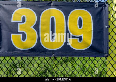 309 foot ft baseball field distance sign in yellow and black mounted on ...