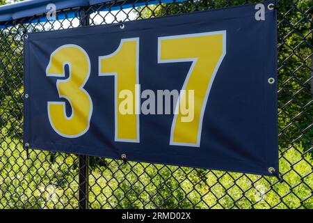 317 foot ft baseball field distance sign in yellow and black mounted on ...