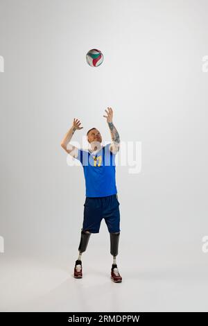 Motivated young man, volleyball player in motion during game, training ...