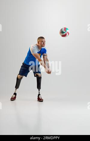 Confident, sporty man with prosthetic legs, disability in uniform ...