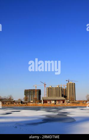 Unfinished construction site in the ice river edge, North China Stock ...