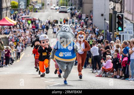 Mascot race at the Scottish Coal Carrying Championships through the ...