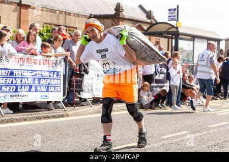 Competitors take part in the Scottish Coal Carrying Championships ...