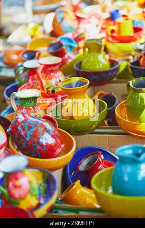 Colorful clay crockery on a farmer market in Cucuron, Provence, France ...