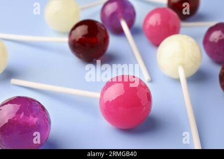 Tasty lollipops on light blue background. Concept of uniqueness Stock ...