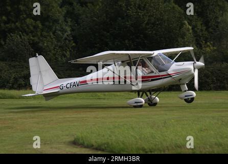 An Ikarus C-42 microlight in action at Popham Airfield Hampshire Stock ...