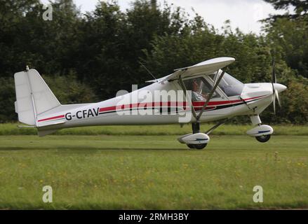 An Ikarus C-42 microlight in action at Popham Airfield Hampshire Stock ...