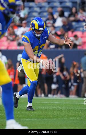 Los Angeles Rams punter Ethan Evans punts against the Denver Broncos ...