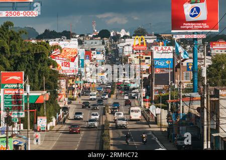 Fast food chains and billboards line the highway of National Route 5 as ...