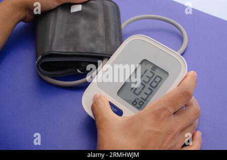 Detail of a modern blood pressure measuring device, symbolizing the ...