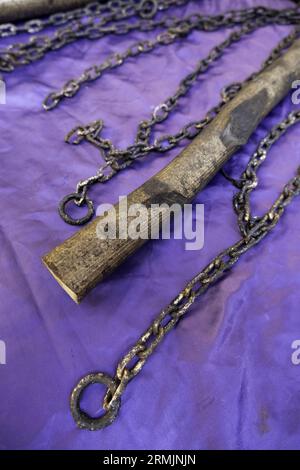 Rusty iron chains, medieval weaponry, inquisition Stock Photo - Alamy