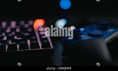 Modern gaming setup with controller, keyboard, and mic in purple ...