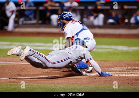 Texas Rangers' Ezequiel Duran, right, slides into second base for a ...