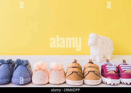 Baby concept with four different pairs shoes Stock Photo - Alamy