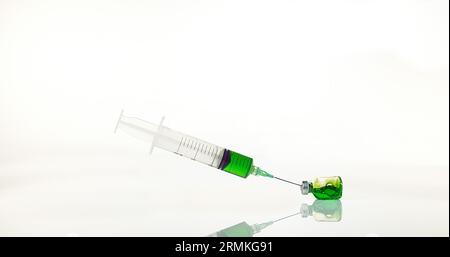 Syringe Falling against White Background Stock Photo - Alamy