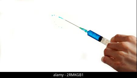 Liquid squirting from Needle against White Background Stock Photo - Alamy