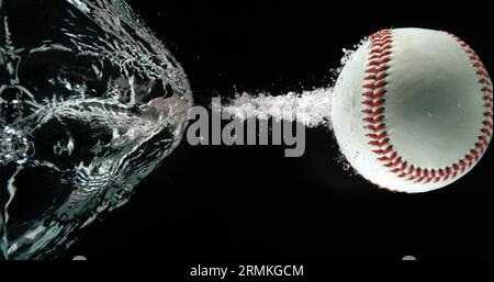 Baseball's Ball Falling into Water against White background Stock Photo ...