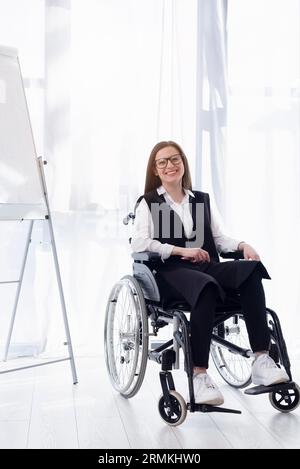 Smiley woman wheelchair Stock Photo - Alamy