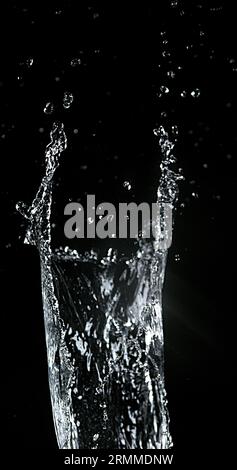 Water spurting out against Black Background Stock Photo - Alamy