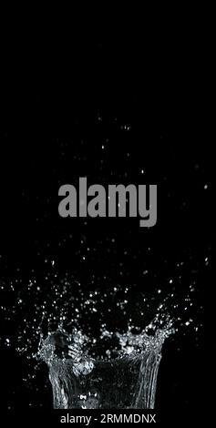 Water spurting out against Black Background Stock Photo - Alamy