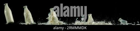 Bottle of Milk Exploding against Black Background Stock Photo - Alamy